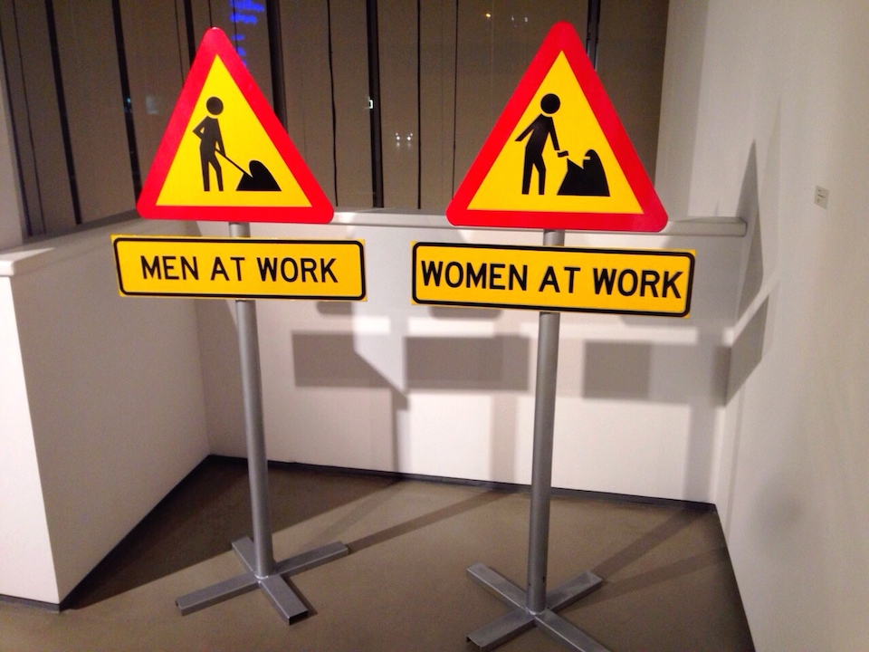 Woman Working Sign